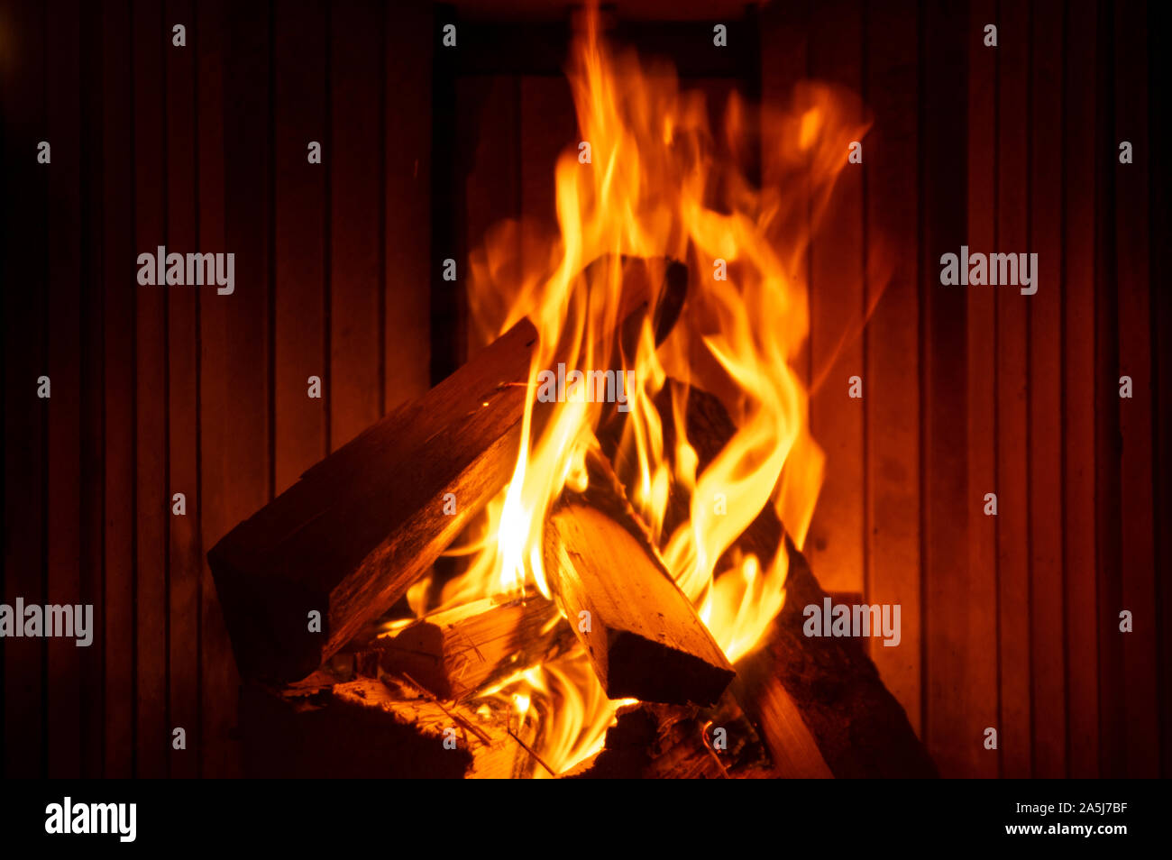 campfire with orange flames and dark black background Stock Photo - Alamy