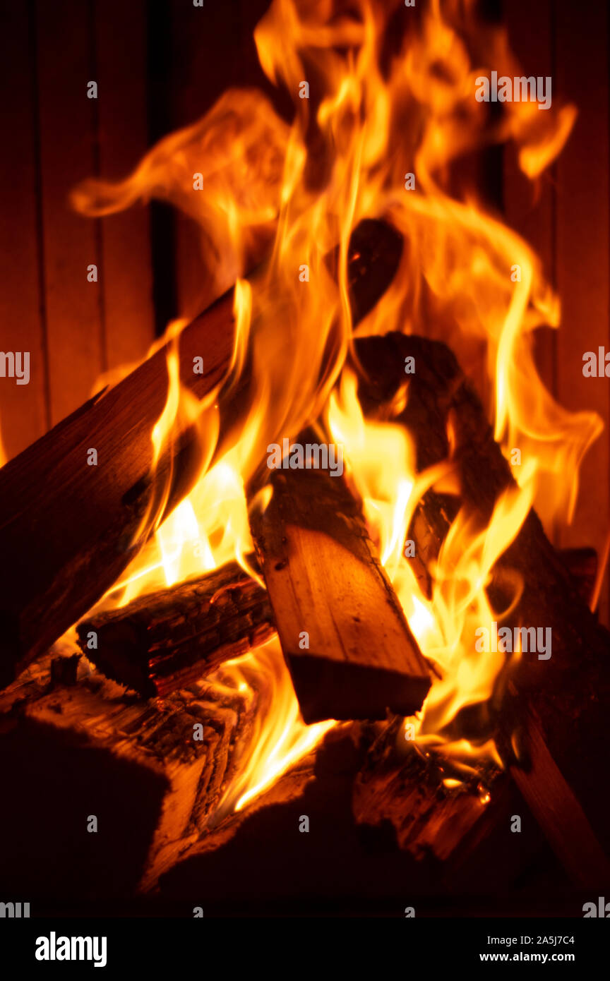 campfire with orange flames and dark black background Stock Photo - Alamy