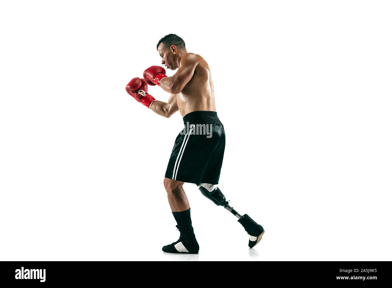 Full length portrait of muscular sportsman with prosthetic leg, copy ...