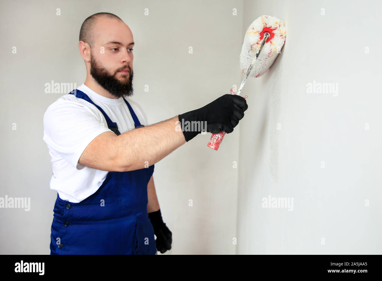 Construction worker doing finish renovation at apartment. Professional ...