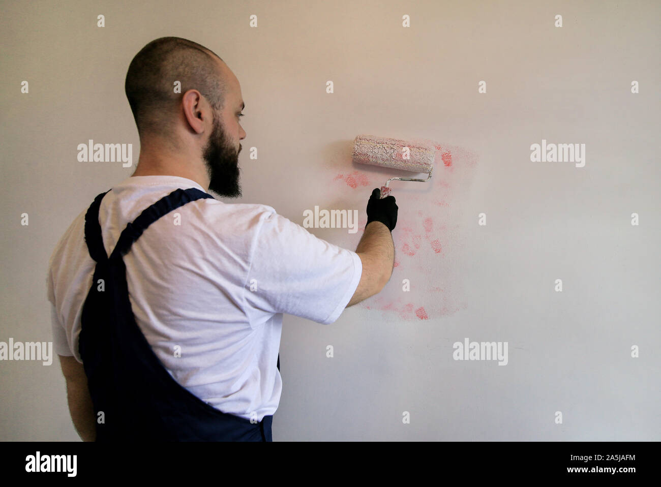 Construction worker doing finish renovation at apartment. Professional ...