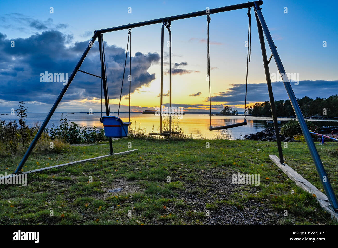 swing infront of lake Vattern in Sweden Stock Photo - Alamy
