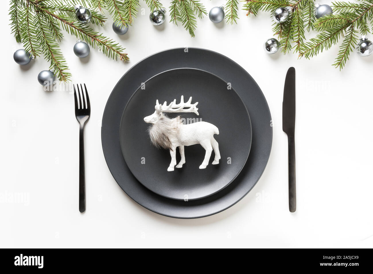 Christmas black table setting with deer on white background. Top view ...