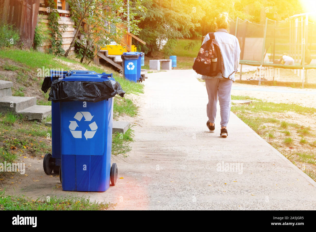 Waste recycling concept. Blue containers for further processing of ...