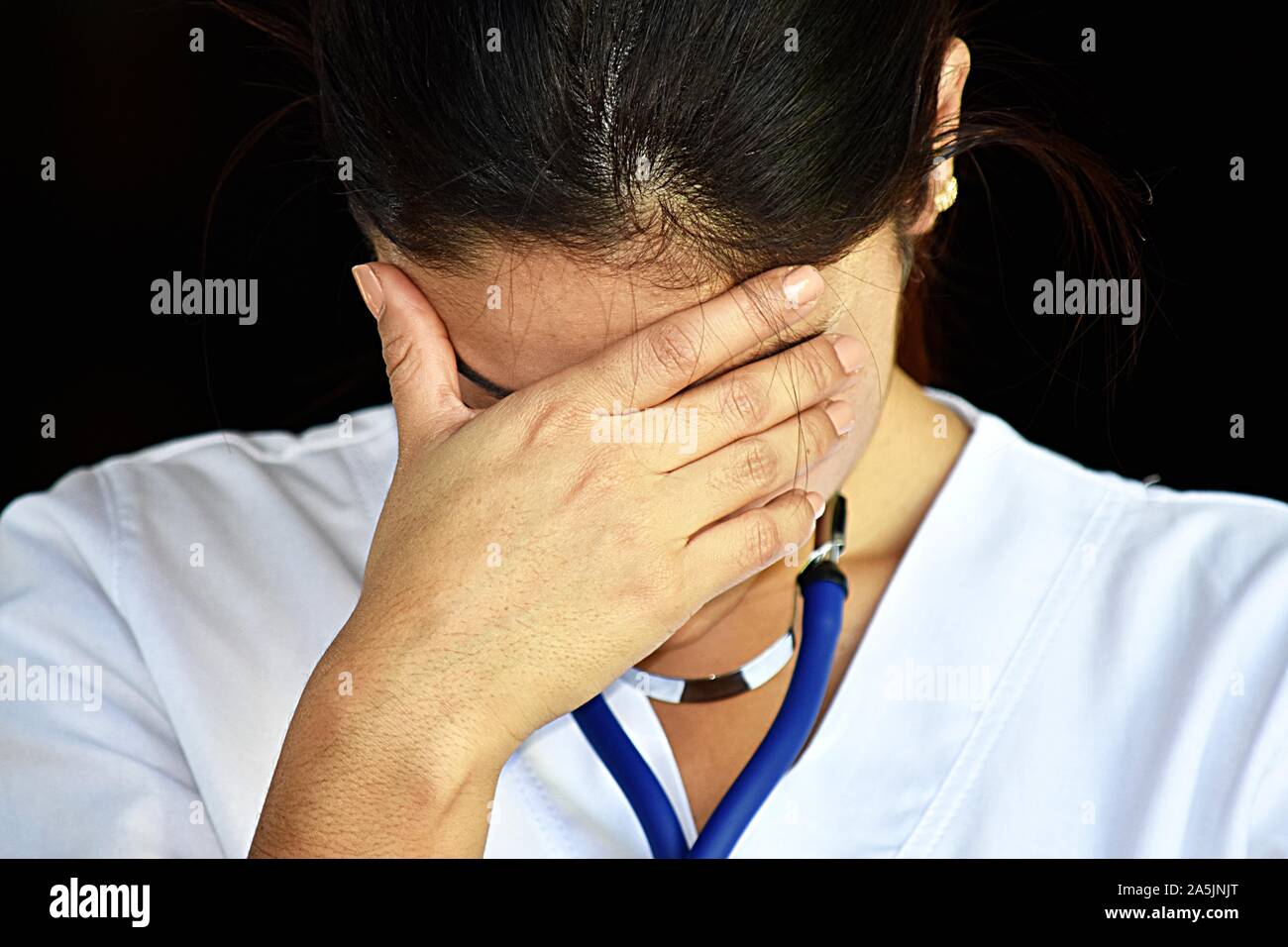 Sad Female Nurse Stock Photo - Alamy