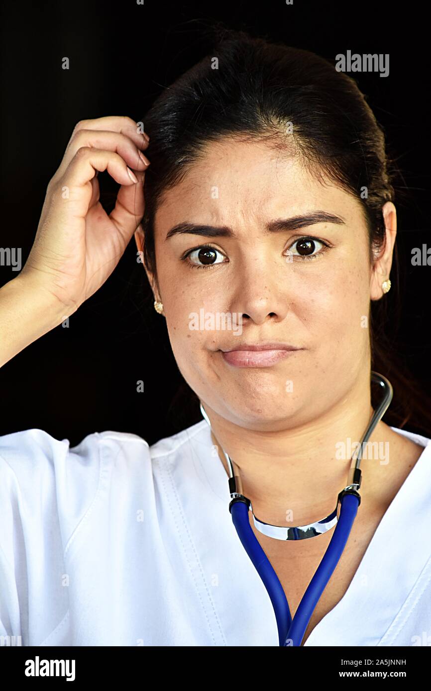 Confused Colombian Female Nurse Stock Photo - Alamy