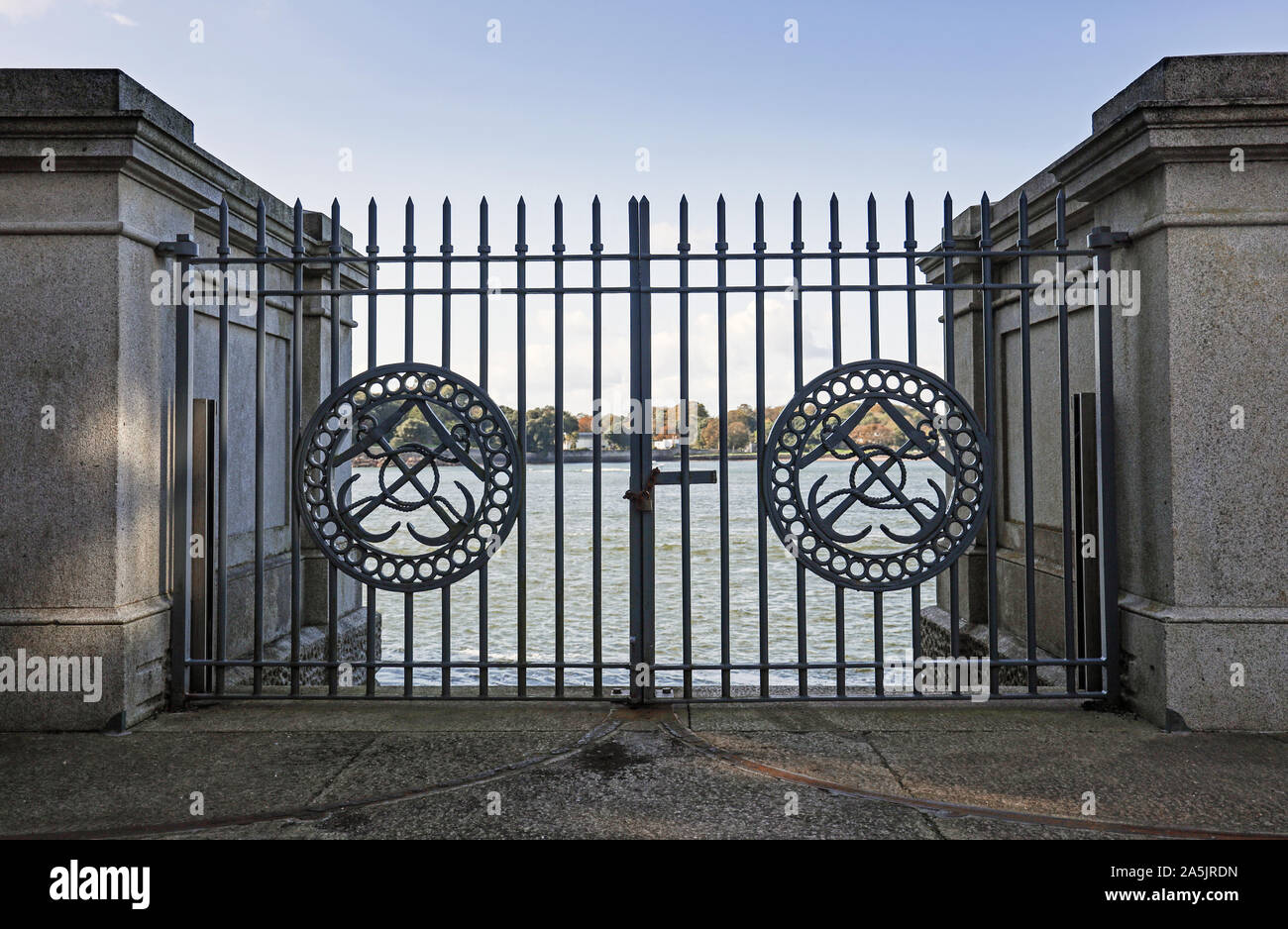 Locked gates with steps to the Hamoaze at the Royal William Yard an ...