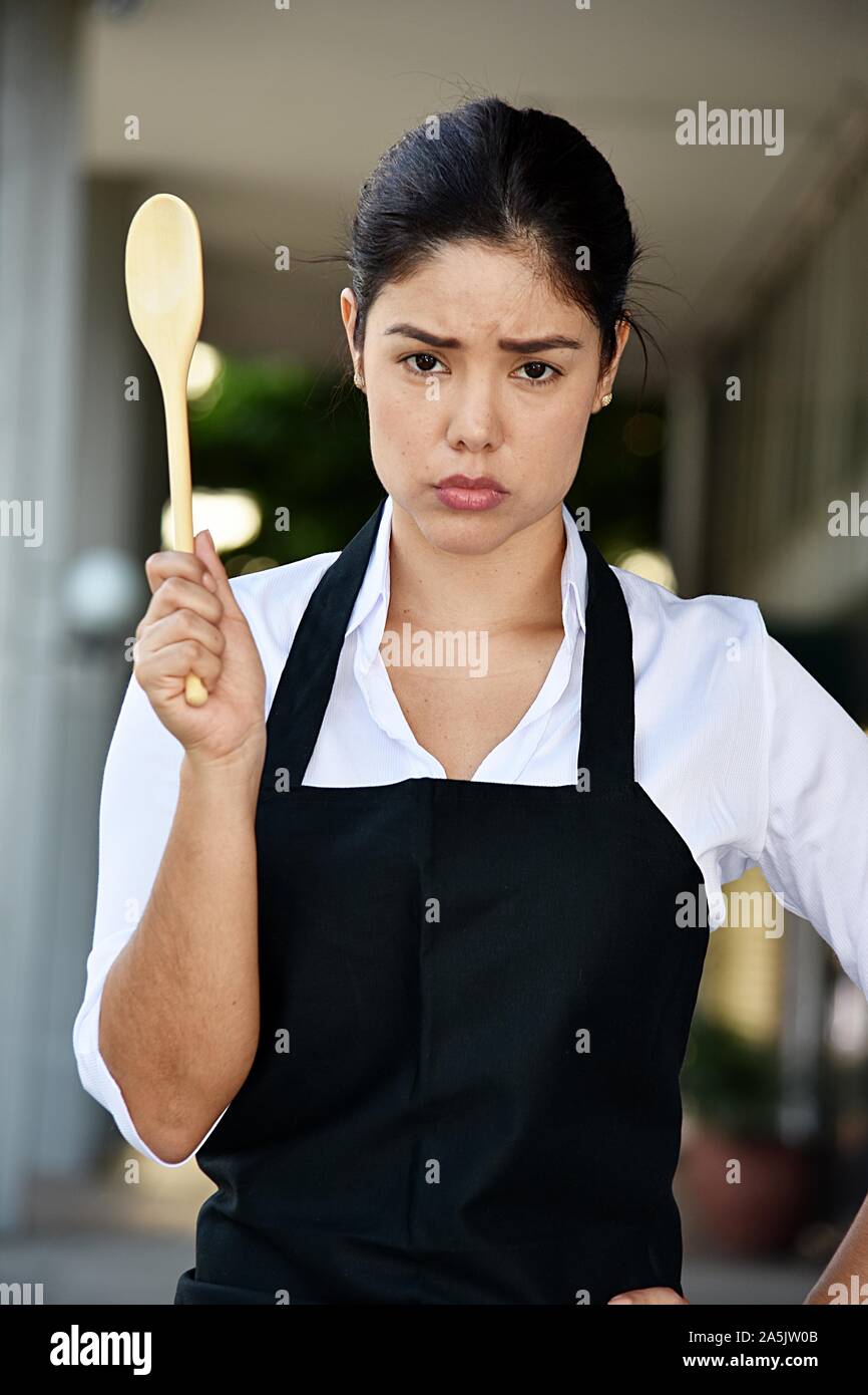 Serious female chef hi-res stock photography and images - Alamy