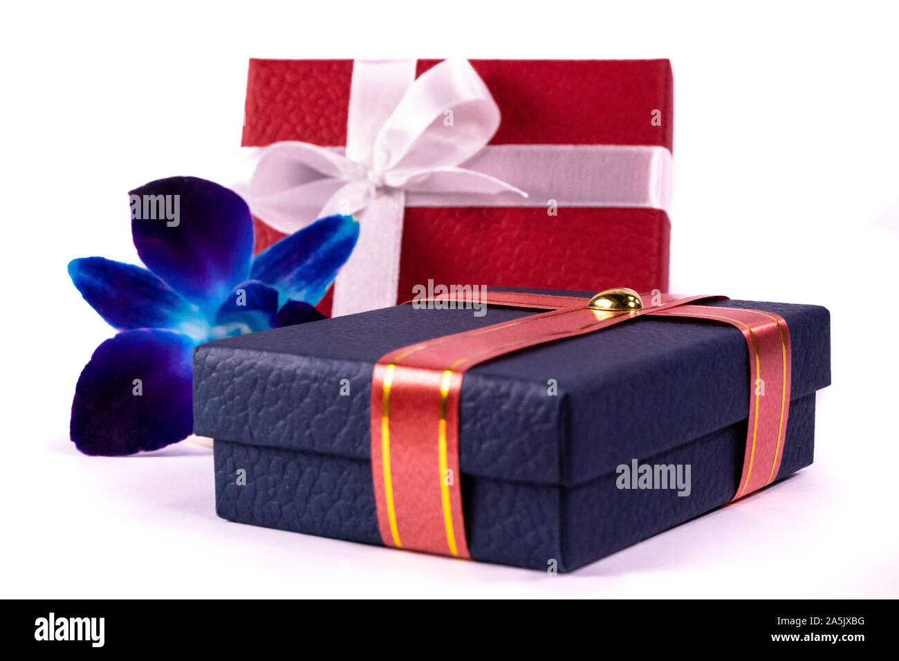 Side view of Decorated blue and red gift box with ribbons and blue ...