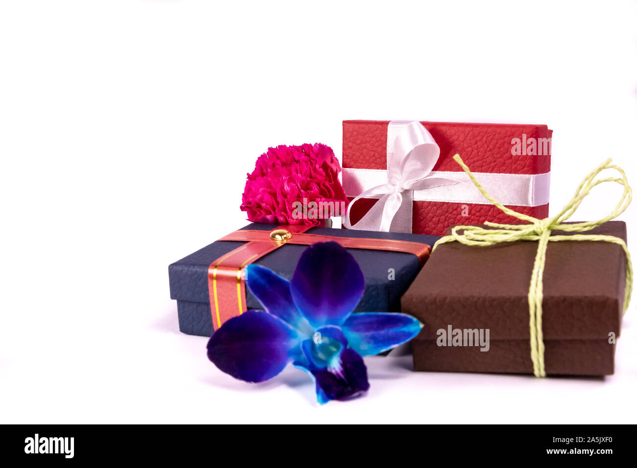 Three gift boxes with beautiful ribbons and threads, blue orchid ...