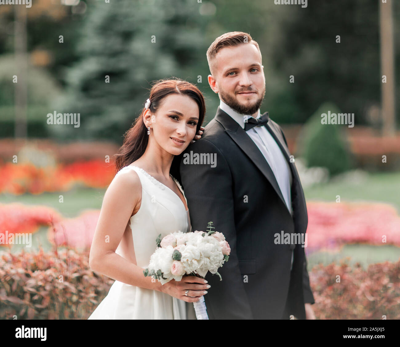 portrait of happy bride and groom on their wedding day. photo with copy ...