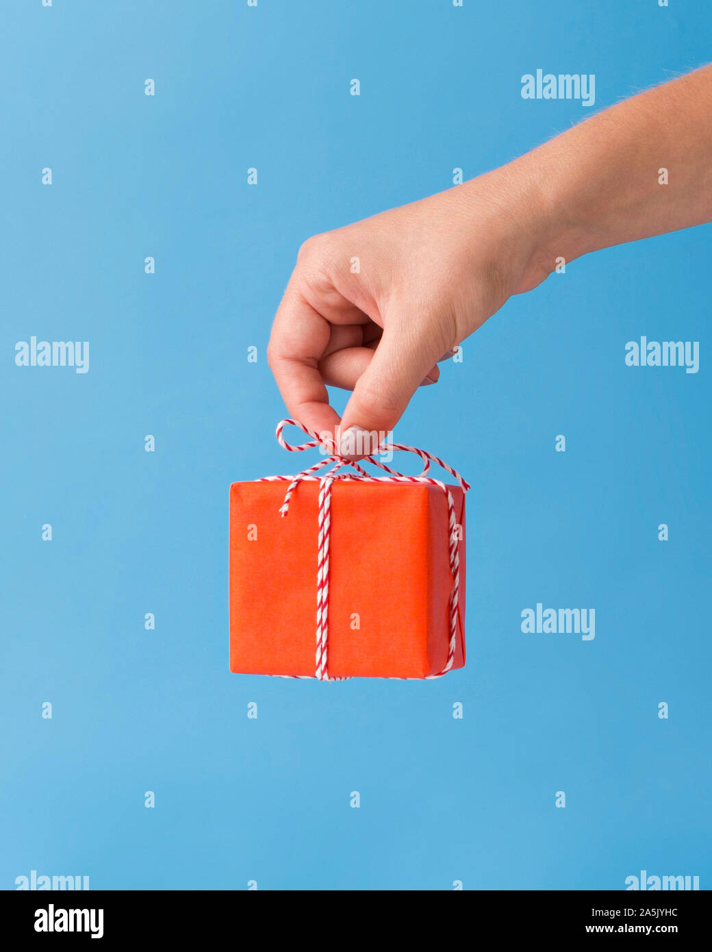 Christmas background with small present in red box Stock Photo - Alamy