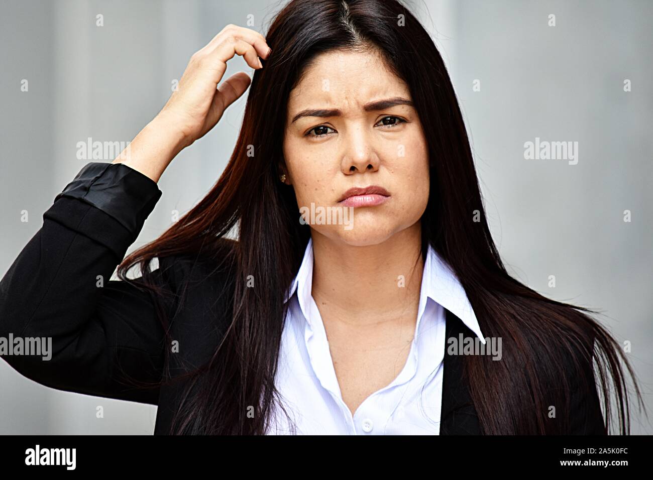 Smart Business Woman And Confusion Stock Photo - Alamy