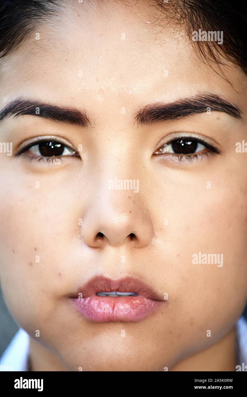 Young Female Face Serious Stock Photo - Alamy
