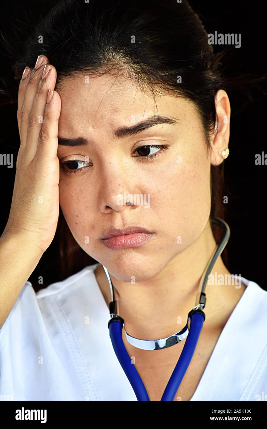 Female Nurse And Sadness Stock Photo - Alamy