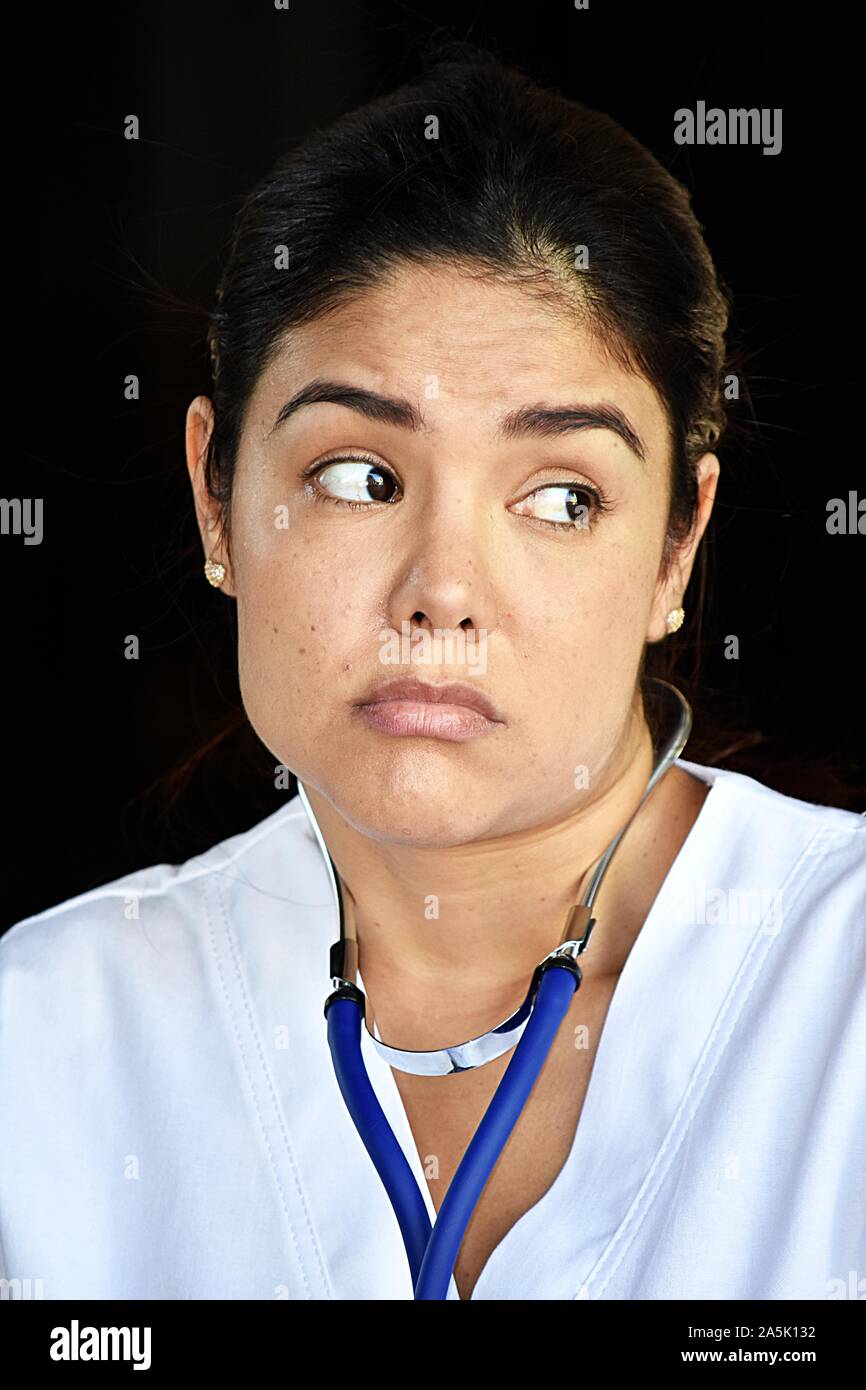 Confused Attractive Female Nurse Wearing Scrubs Stock Photo - Alamy