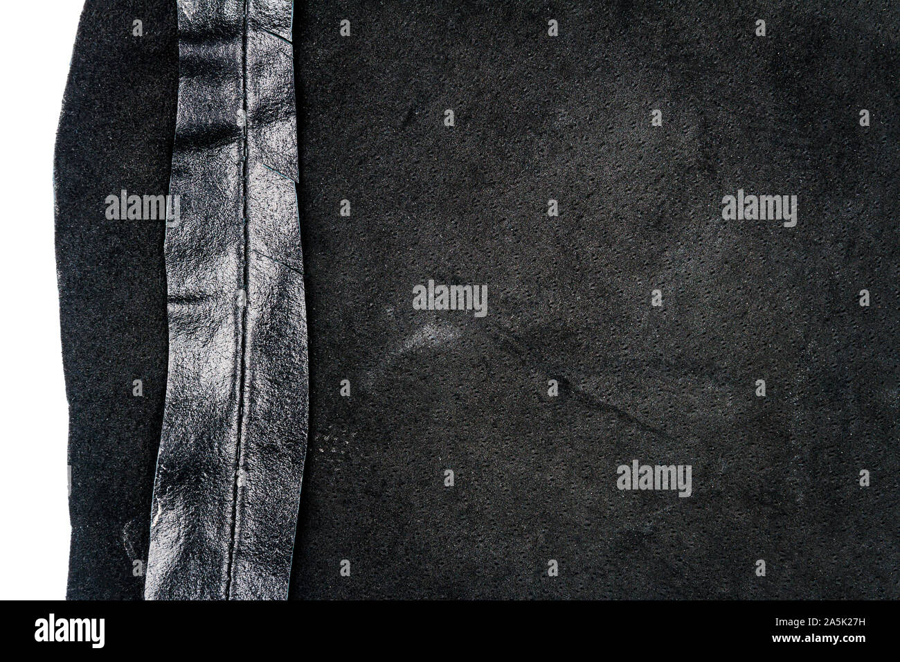 Piece of messy black leather isolated on white background. Crumpled ...
