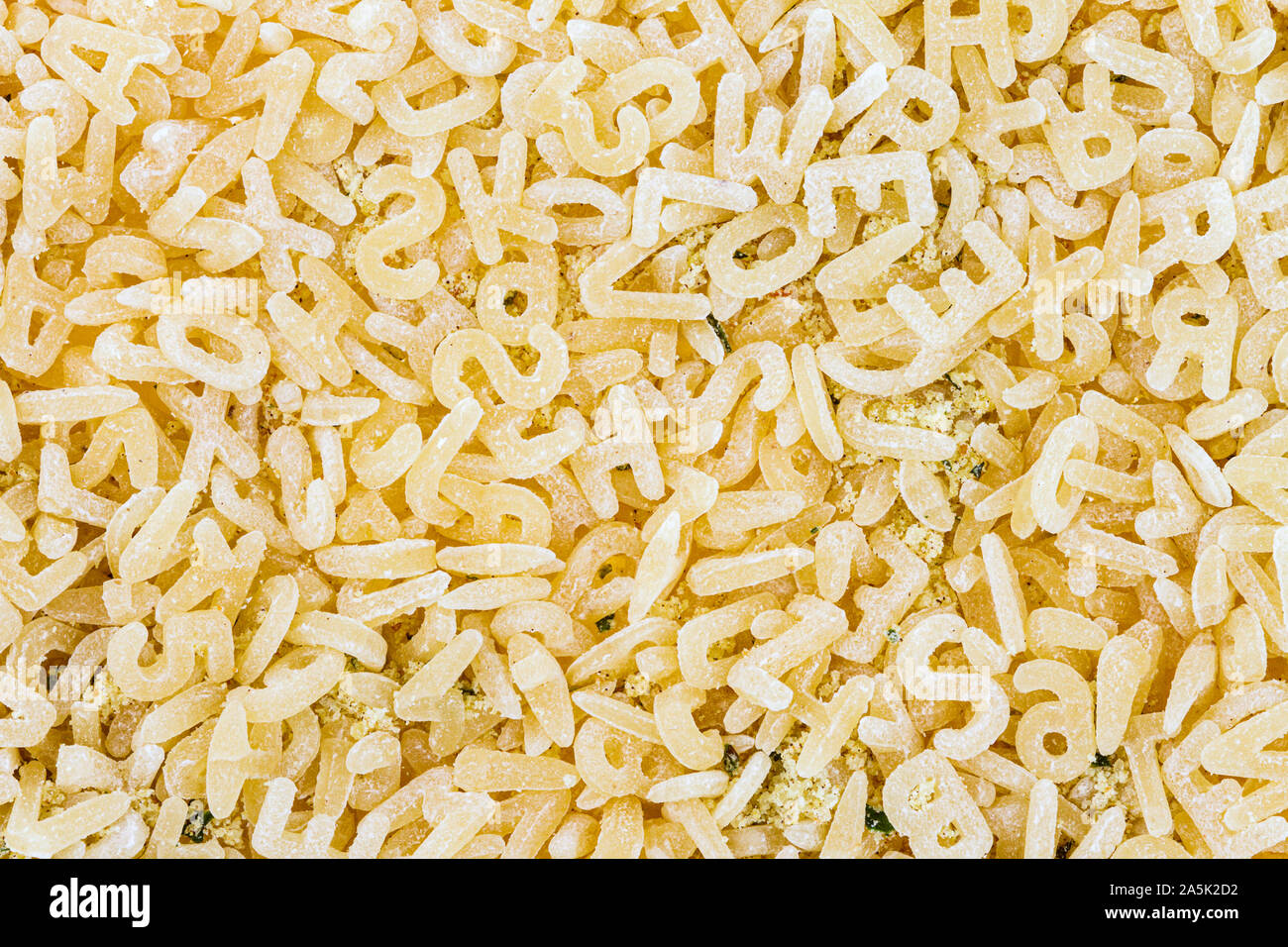 Texture of raw alphabet abc letter pasta Stock Photo - Alamy
