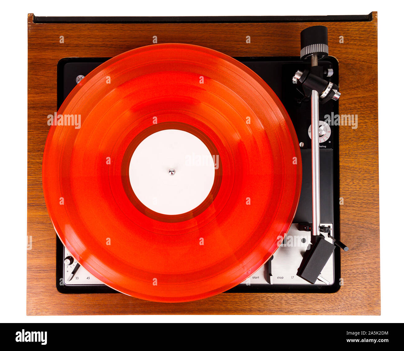 Vintage turntable with a red vinyl isolated on white. Wooden plinth ...