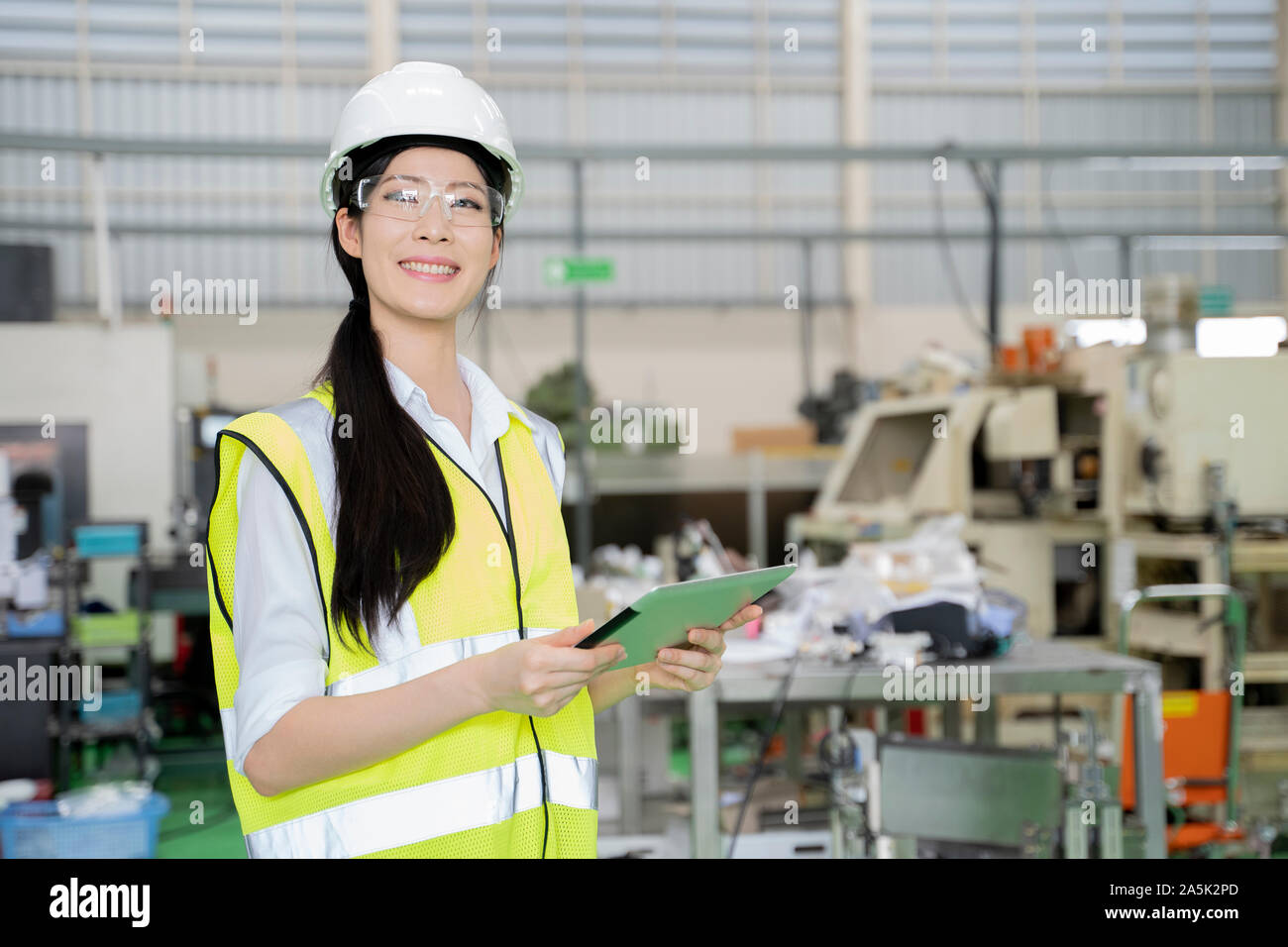 Happy sewing factory worker hi-res stock photography and images - Alamy