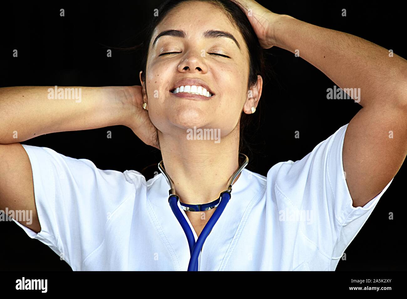 Stretching Young Colombian Female Nurse Wearing Scrubs Stock Photo - Alamy