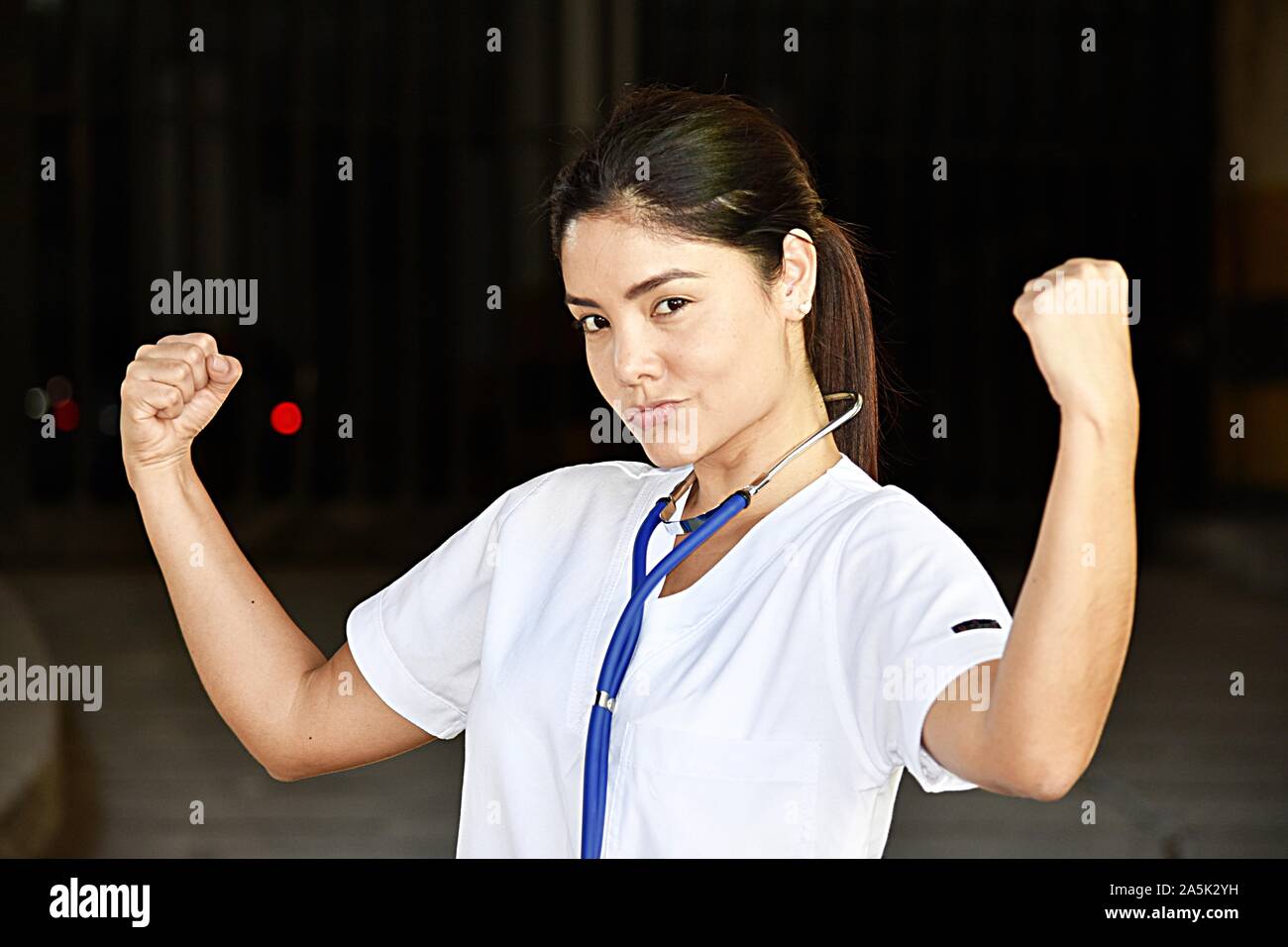 Strong Female Nurse Wearing Scrubs Stock Photo - Alamy