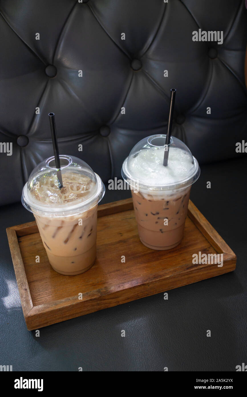Iced coffee on wooden outdoors table, stock photo Stock Photo - Alamy