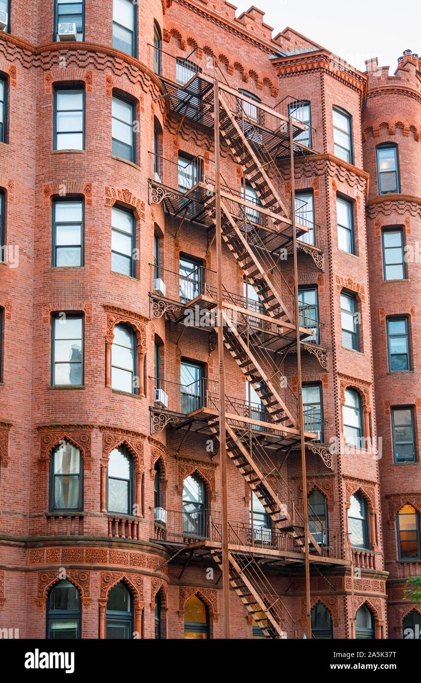 Typical external metal fire escape ladders on a red brick building in ...
