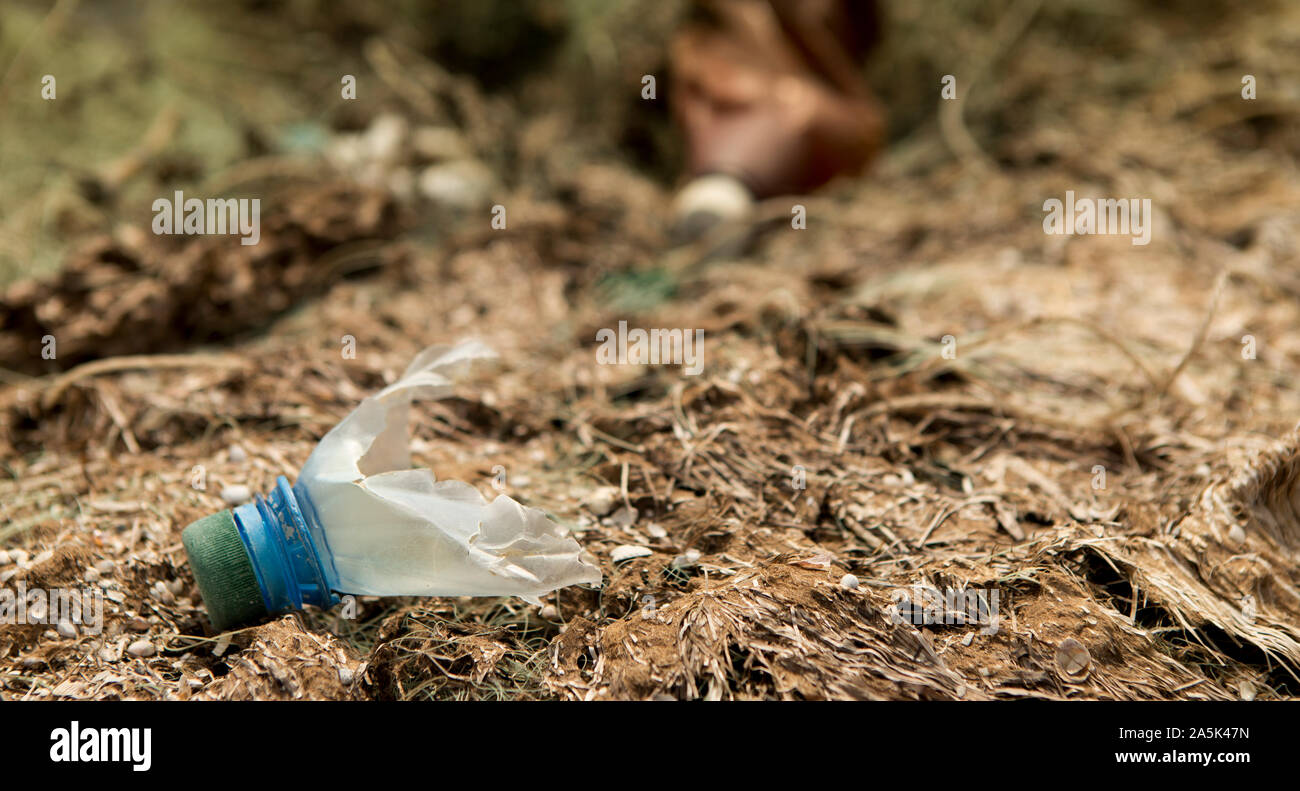 Plastic garbage on seaside, beach pollution concept Stock Photo - Alamy