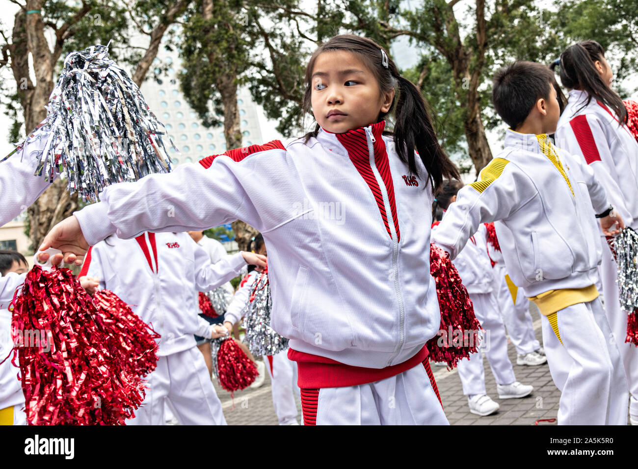 Young Chinese children rehearse cheerleading routines at Statue Square ...