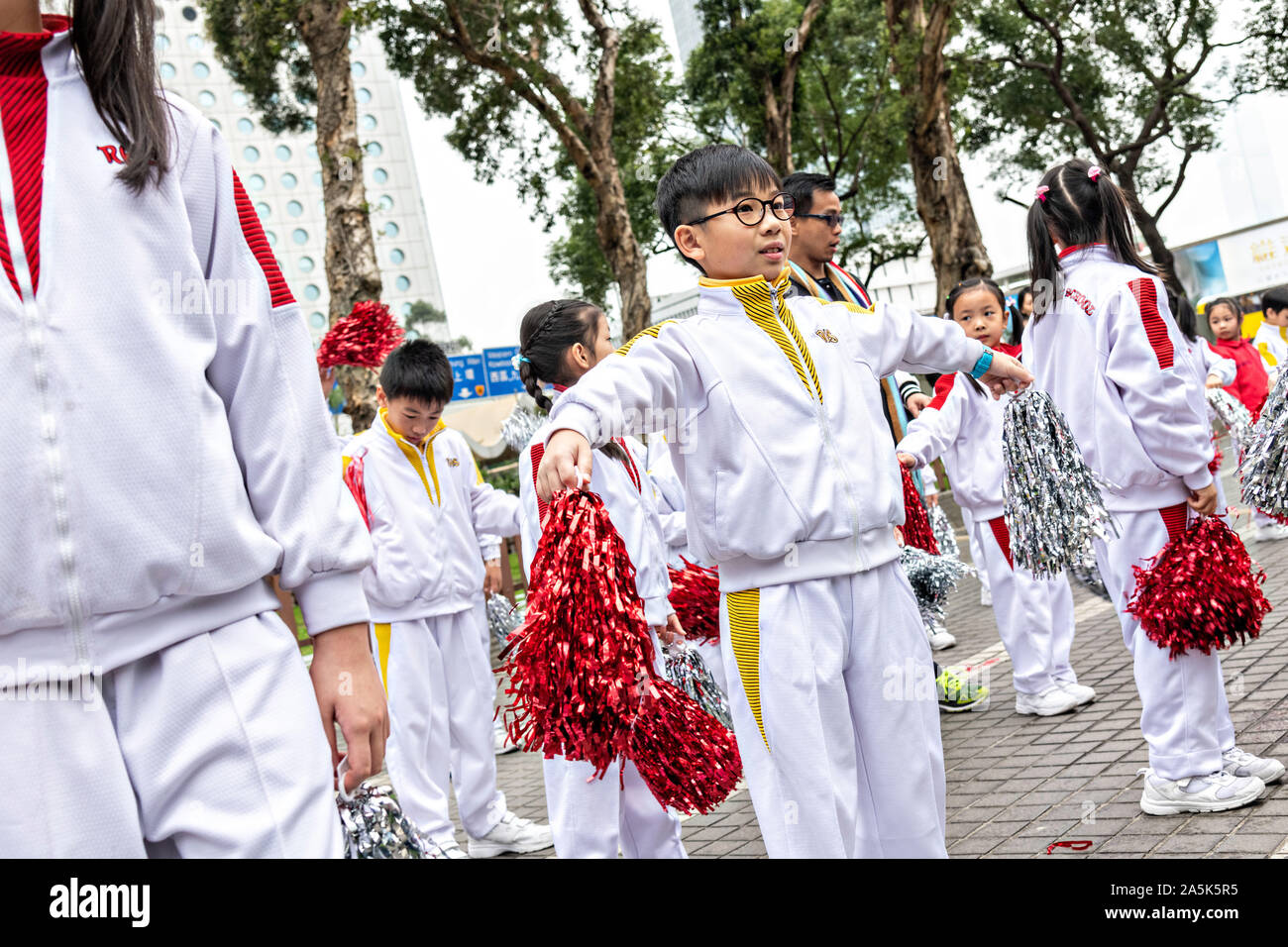 Young Chinese children rehearse cheerleading routines at Statue Square ...