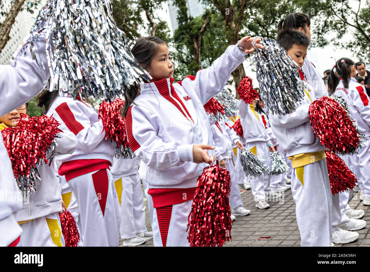 Young Chinese children rehearse cheerleading routines at Statue Square ...