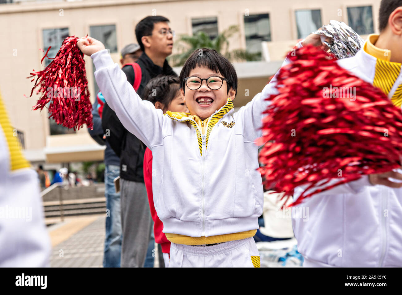 Young Chinese children rehearse cheerleading routines at Statue Square ...