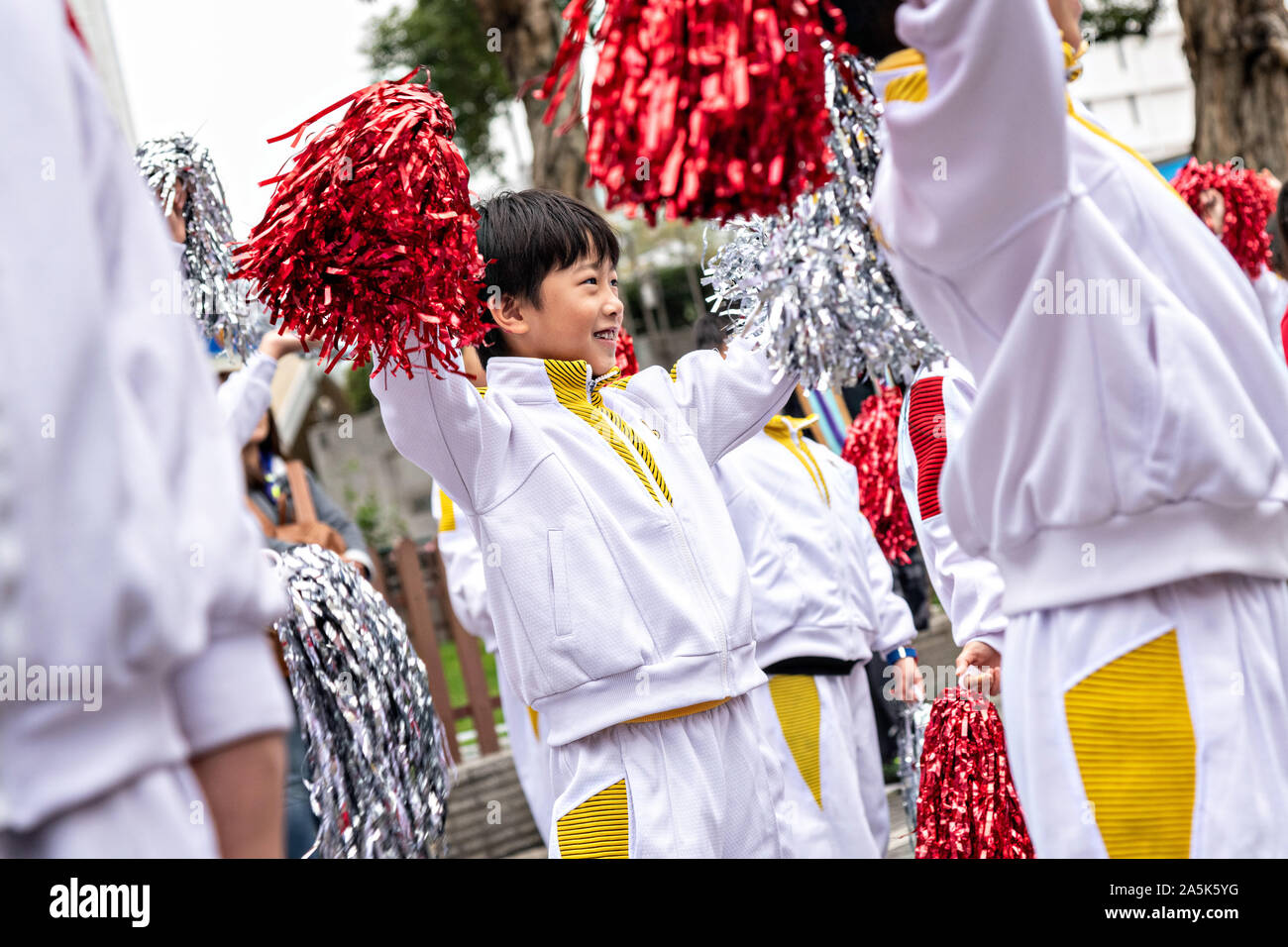 Young Chinese children rehearse cheerleading routines at Statue Square ...