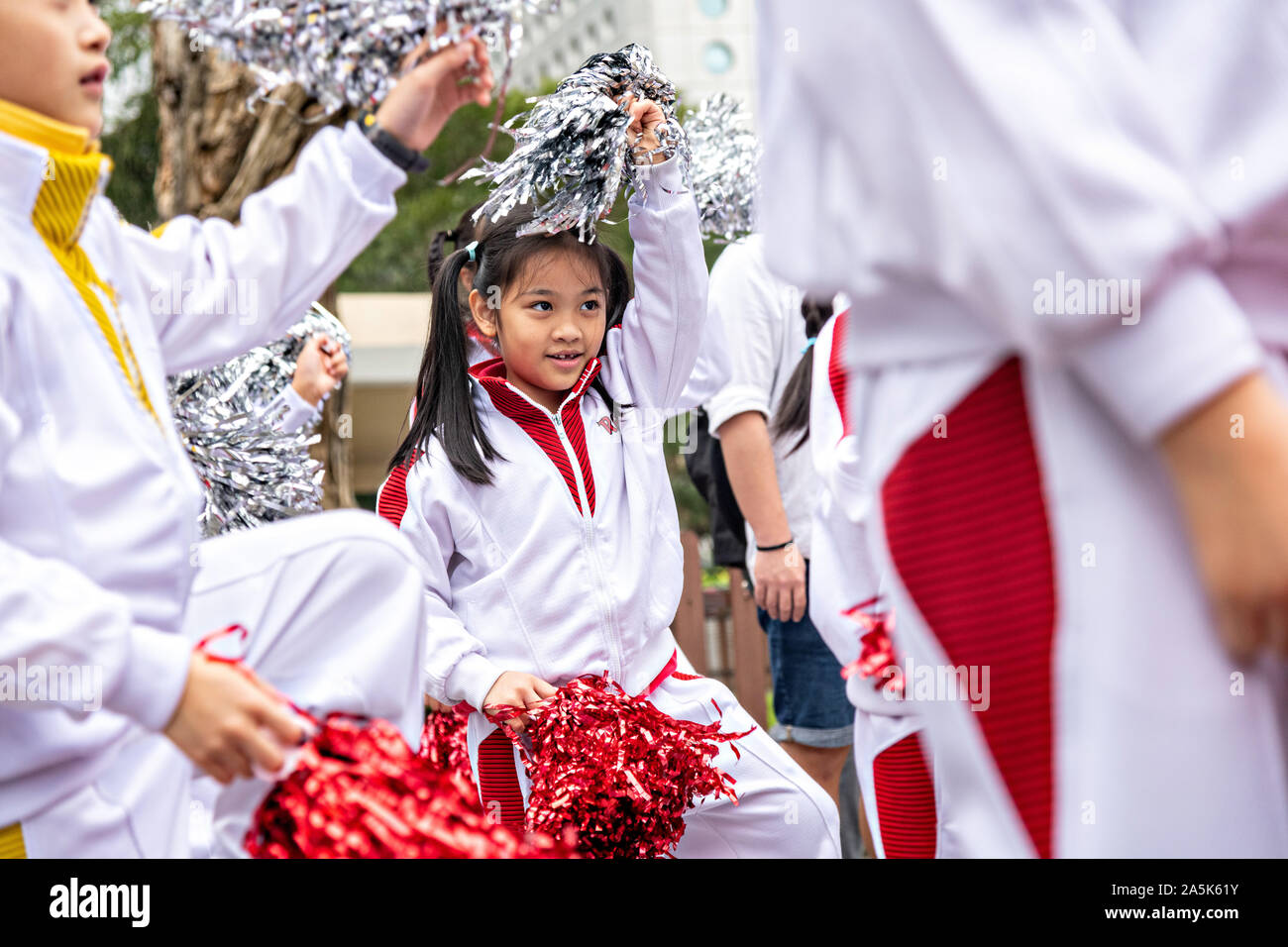 Young Chinese children rehearse cheerleading routines at Statue Square ...