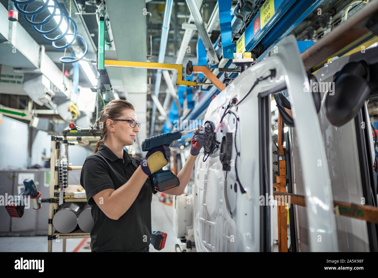 Woman working on production line hi-res stock photography and images ...