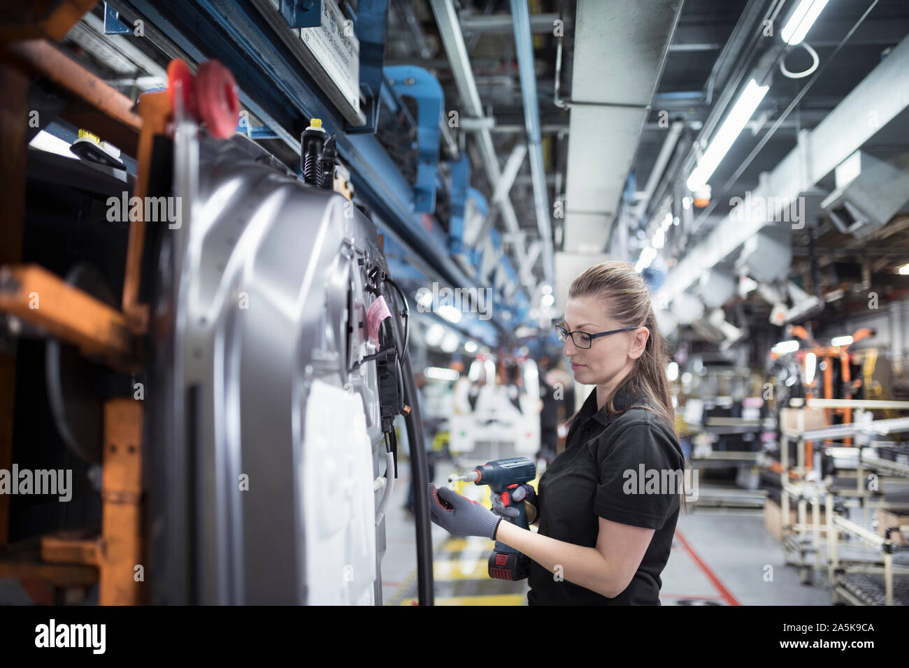 Woman Working On Production Line High Resolution Stock Photography and ...