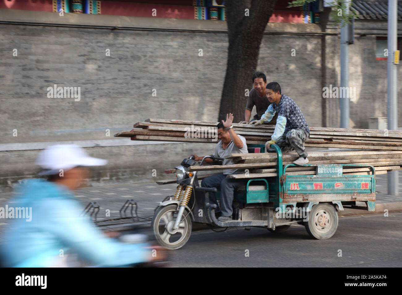 Three people on a motorcycle hi-res stock photography and images - Alamy