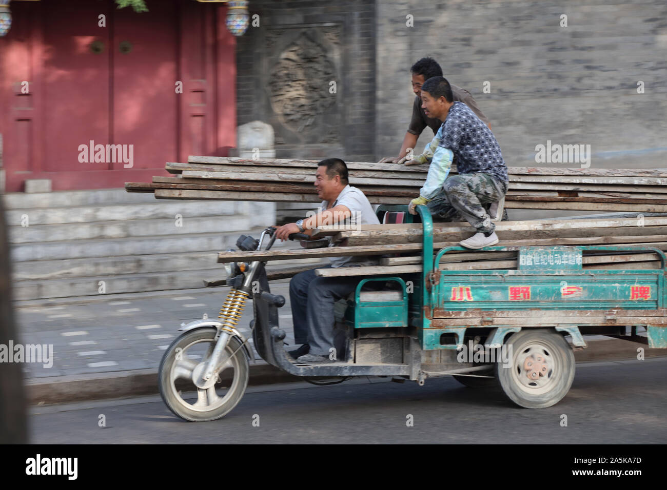 Three people on a motorcycle hi-res stock photography and images - Alamy