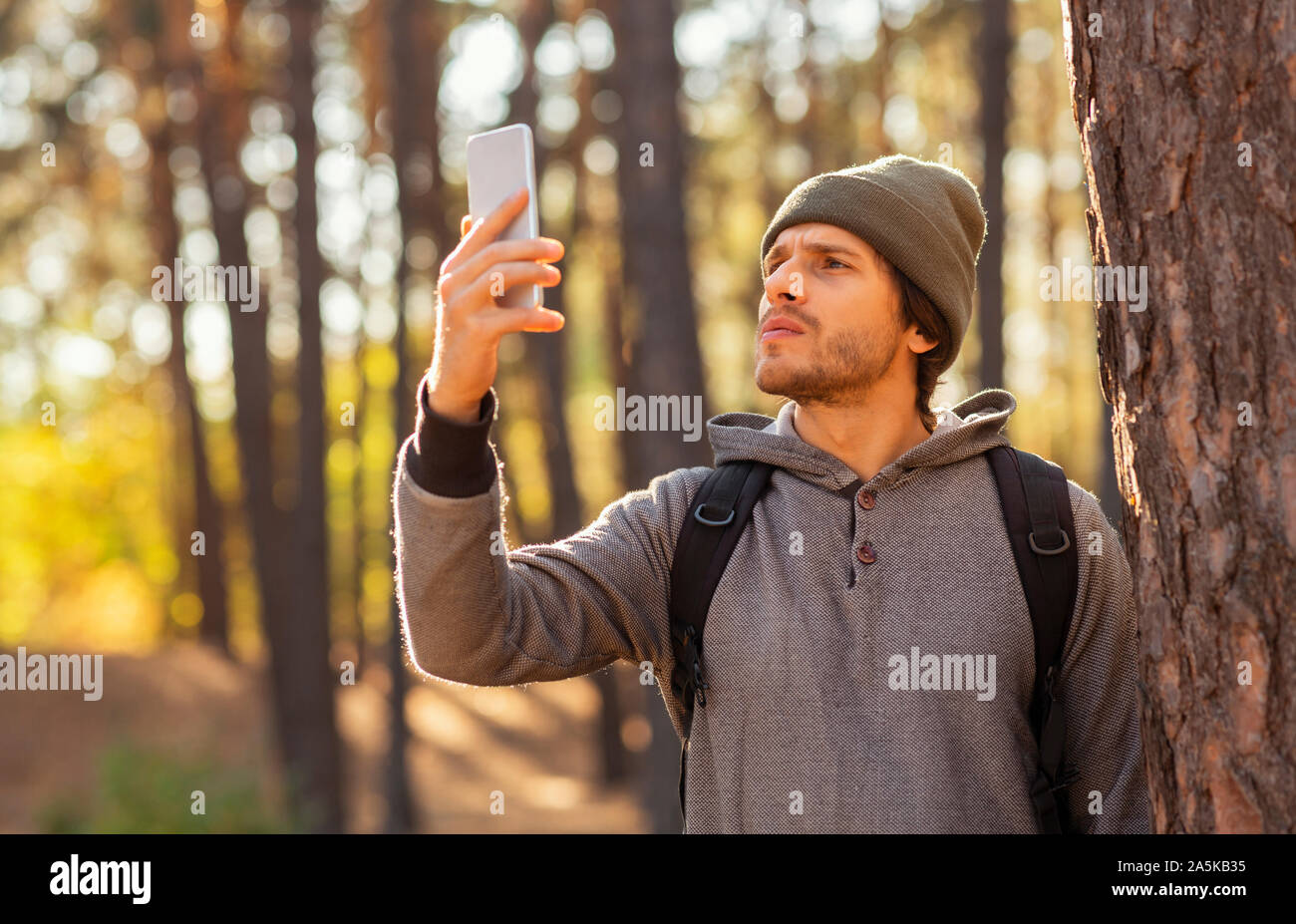 Checking smartphone adult hiker hi-res stock photography and images - Alamy