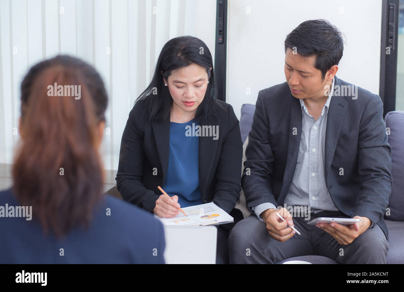Team work around a table hi-res stock photography and images - Alamy