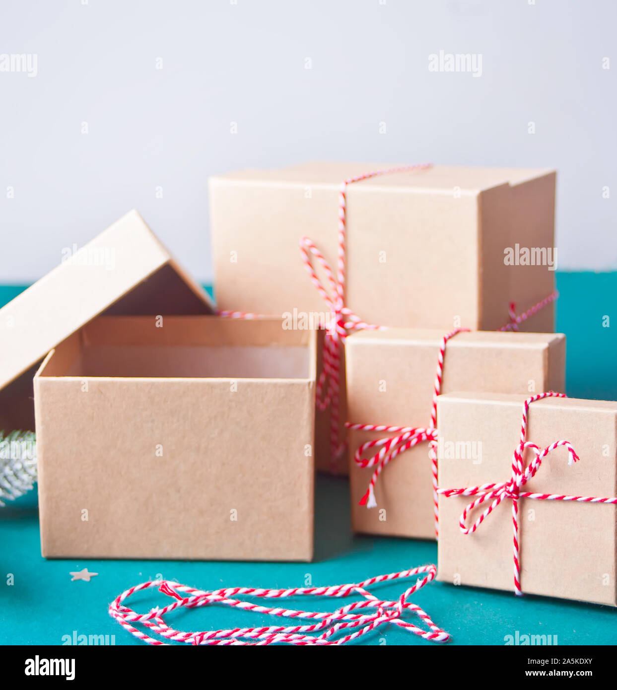Different sizes Christmas gift boxes on the blue background. One box is ...
