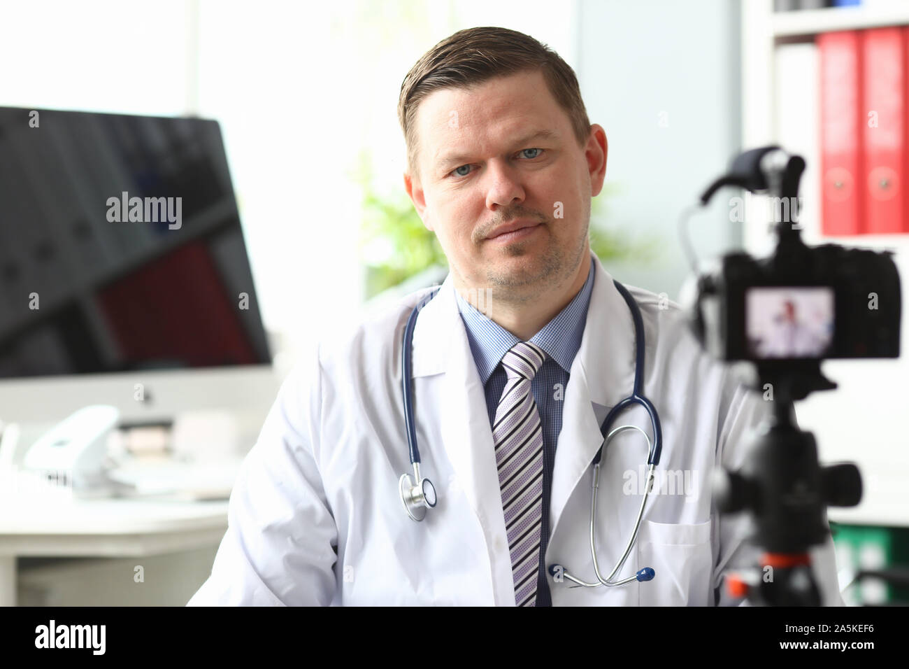 Smart doctor in office Stock Photo - Alamy