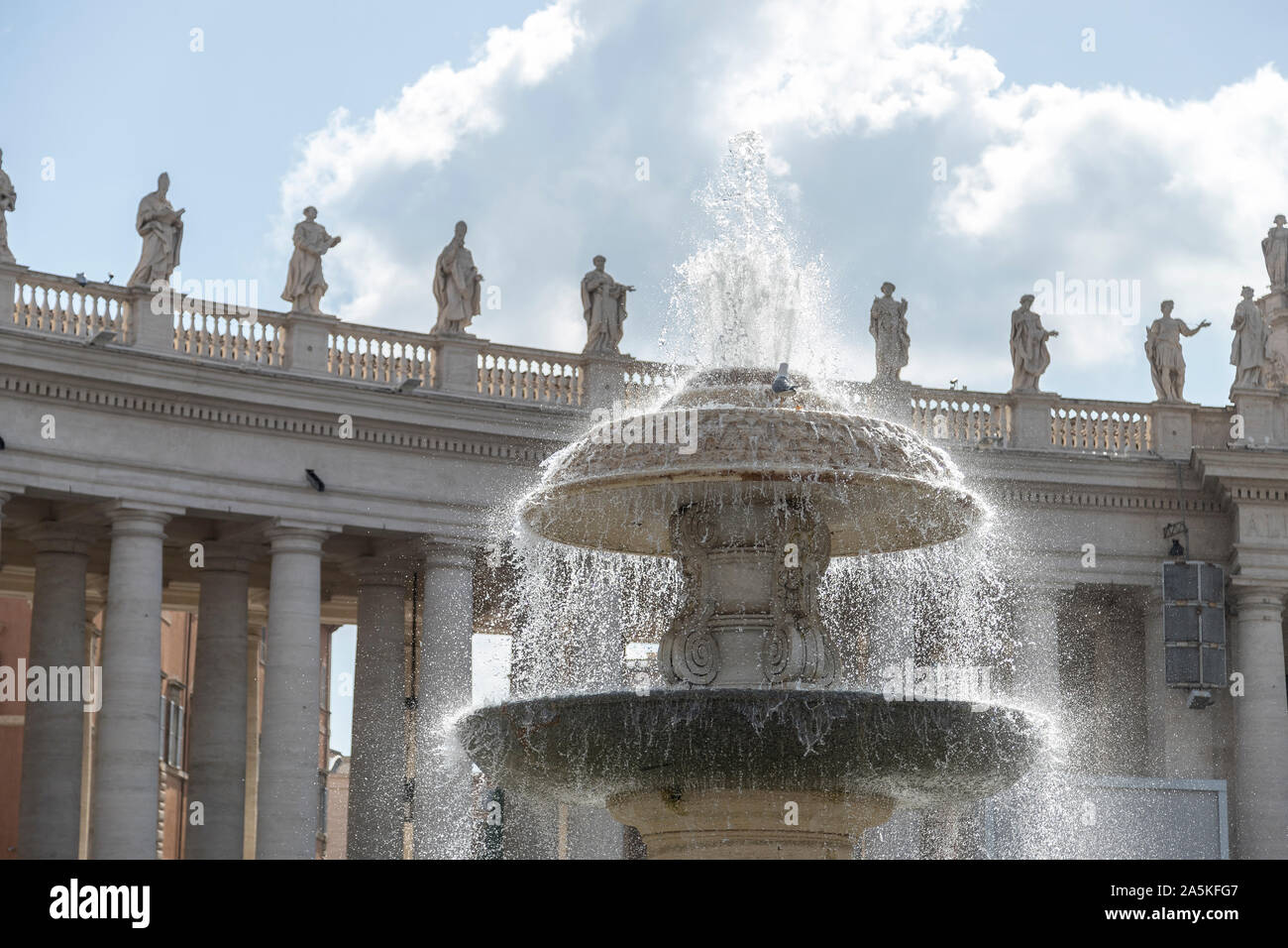 View of the fountain against St. Peter's Basilica, Vatican, Italy. Soft ...