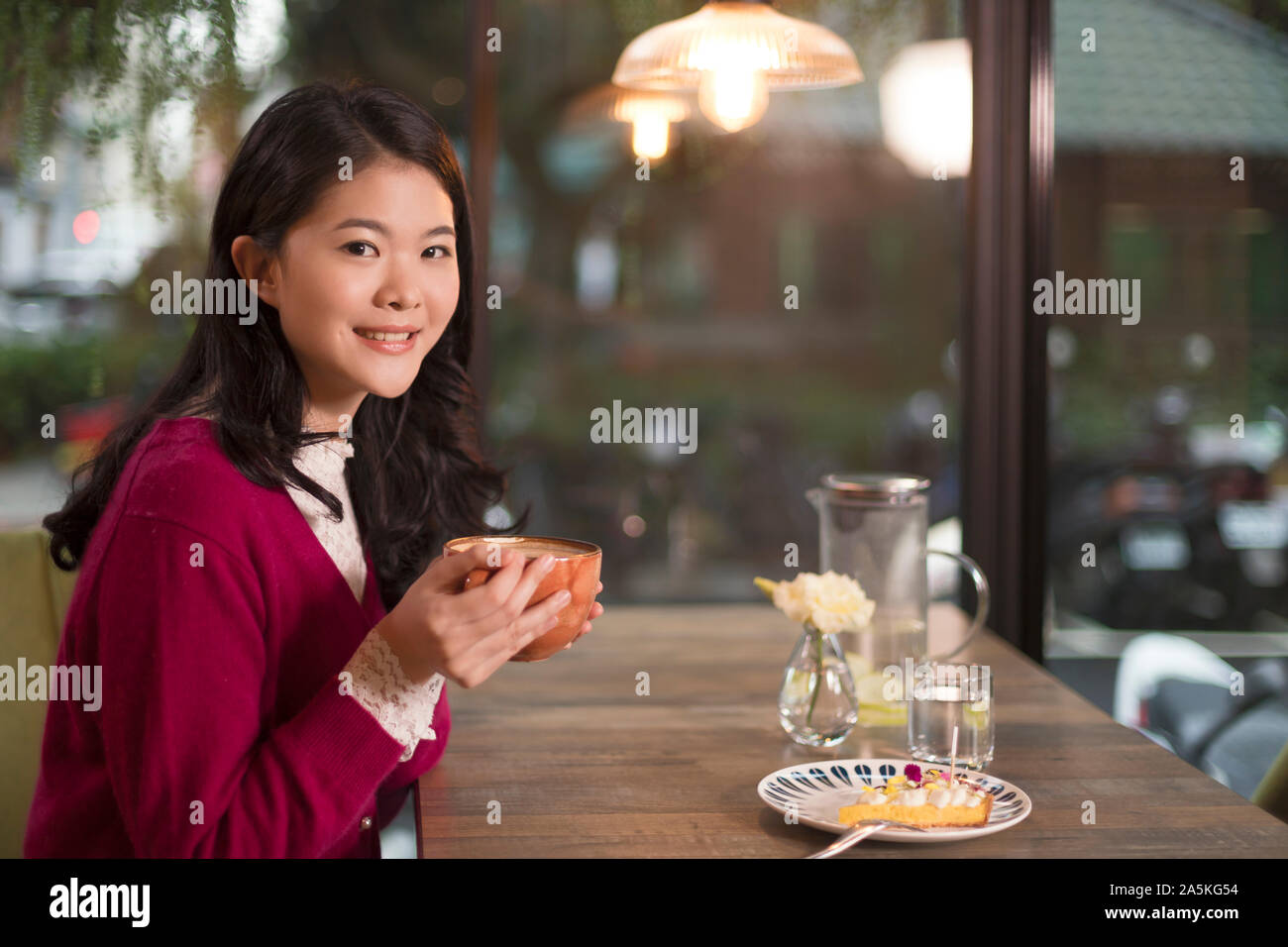 Beautiful woman sitting table in hi-res stock photography and images ...