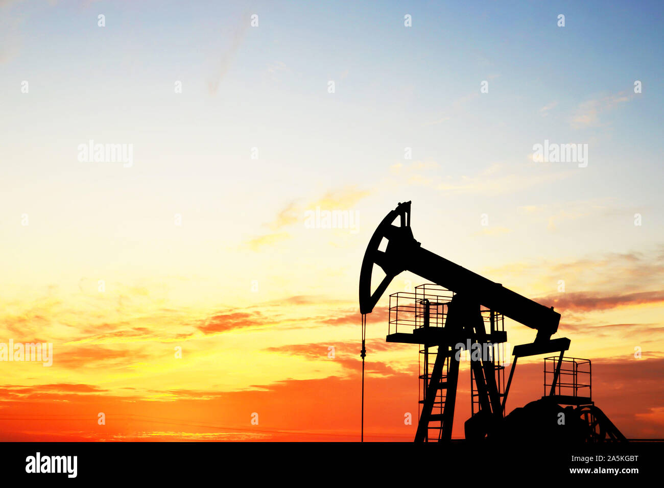 Oil drilling derricks at desert oilfield. Crude oil production from the ...