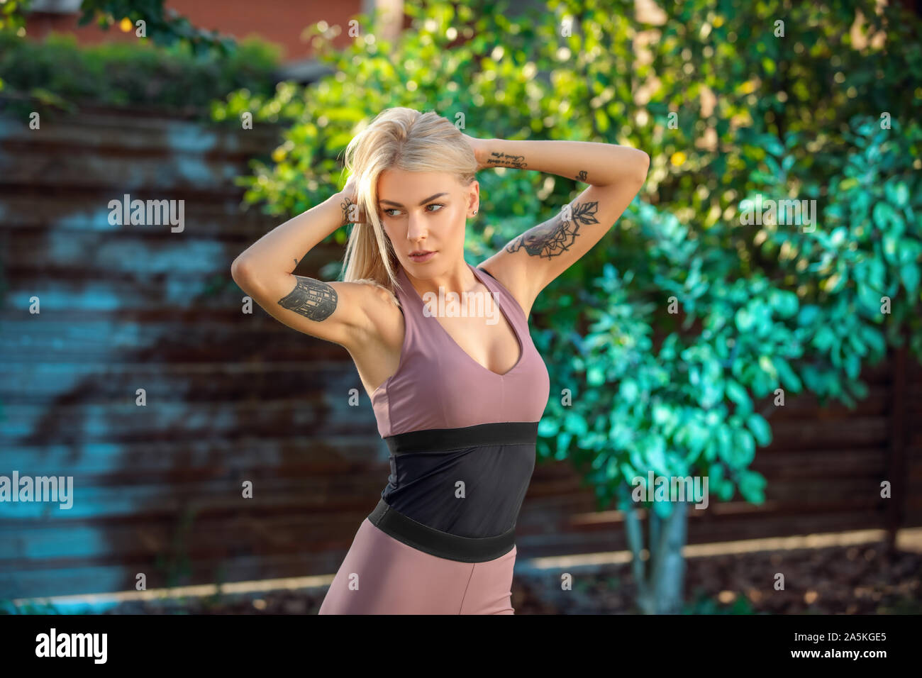 Beautiful fitness model girl posing wearing sport clothes. Girl in the ...