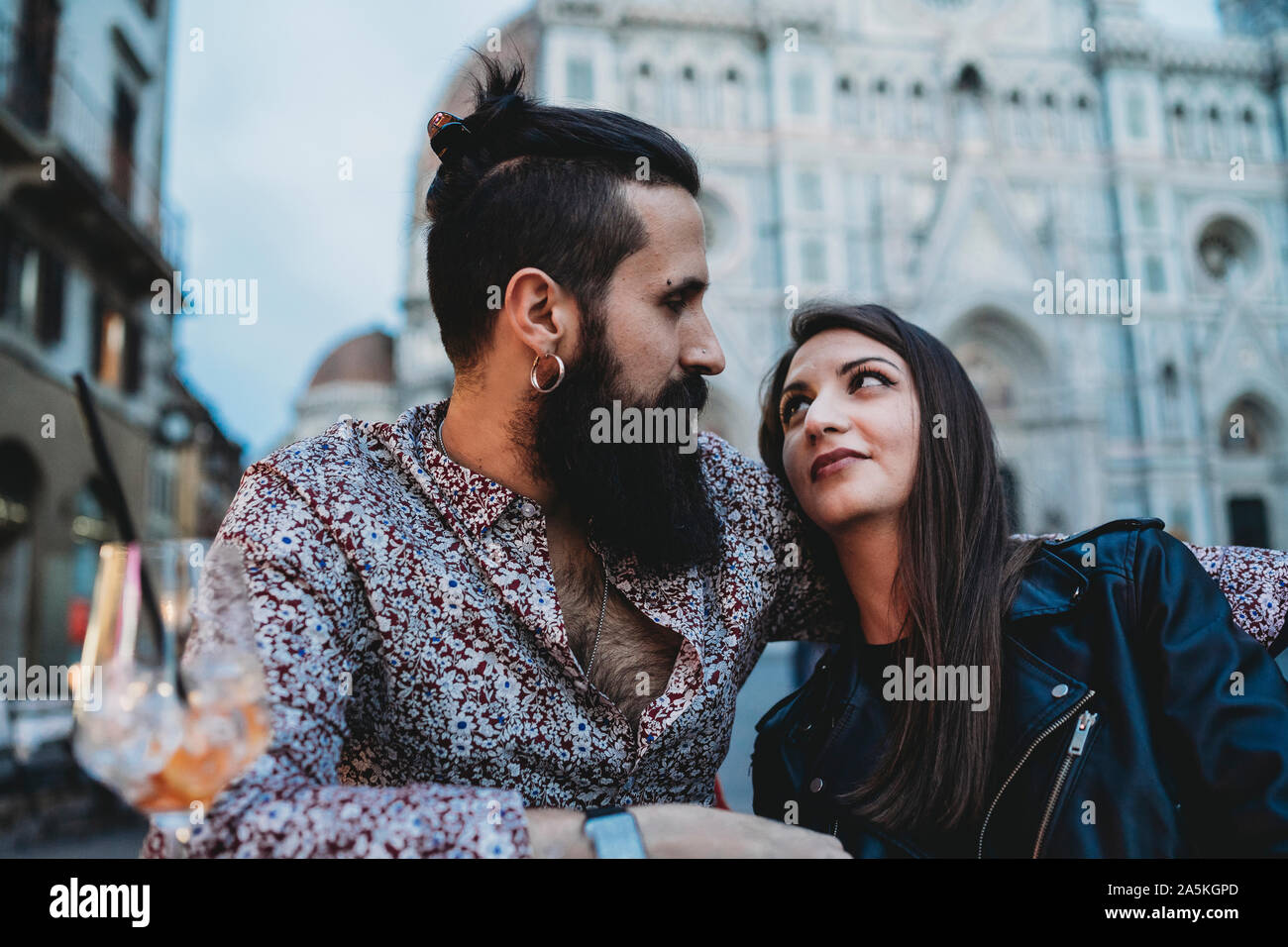 Couple gazing lovingly into each other's eyes in cafe, Santa Maria del ...