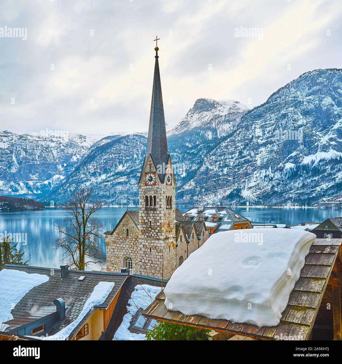 The scenic cityscape of winter Hallstatt with snowy roofs of old ...