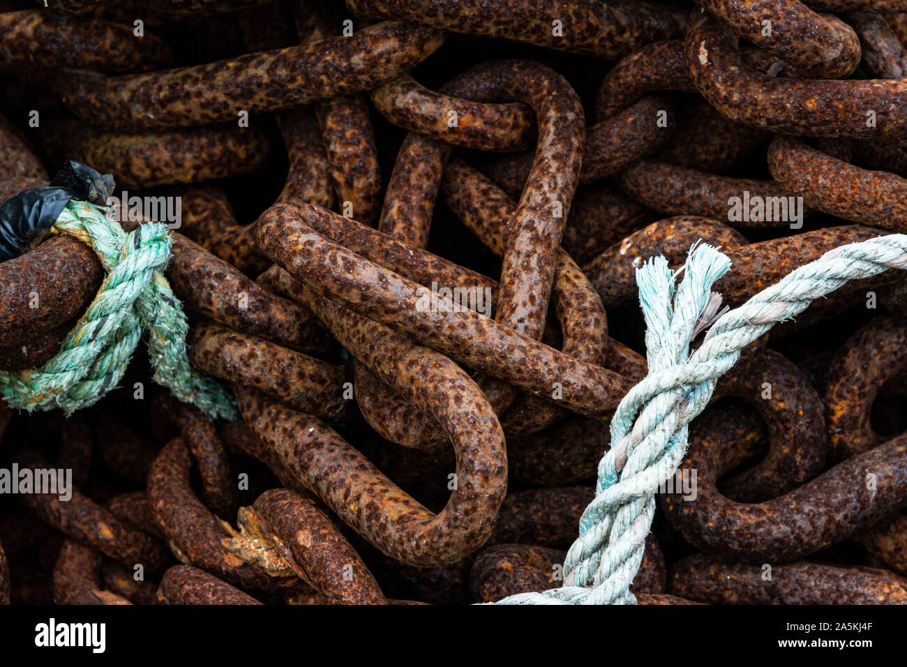 A close up of rusty chains and rope Stock Photo - Alamy